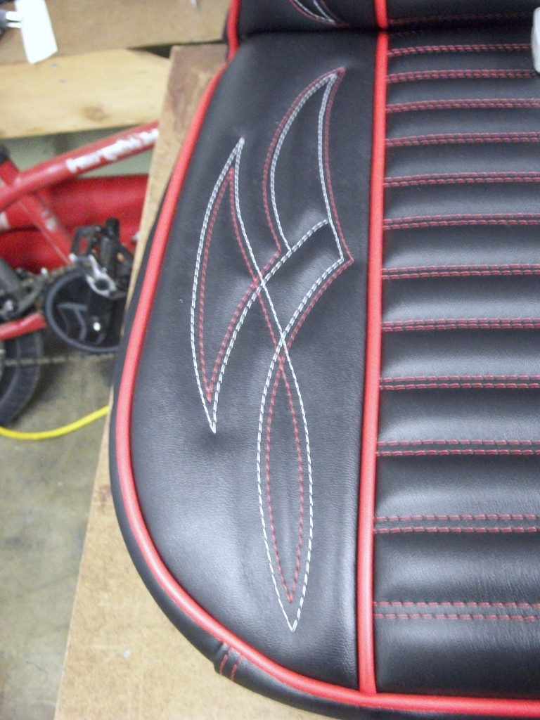 Hot rod seat in black and red. Red and white pinstripe stitching ...